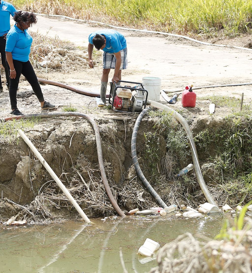 Farmers help clear water channels - Trinidad Guardian