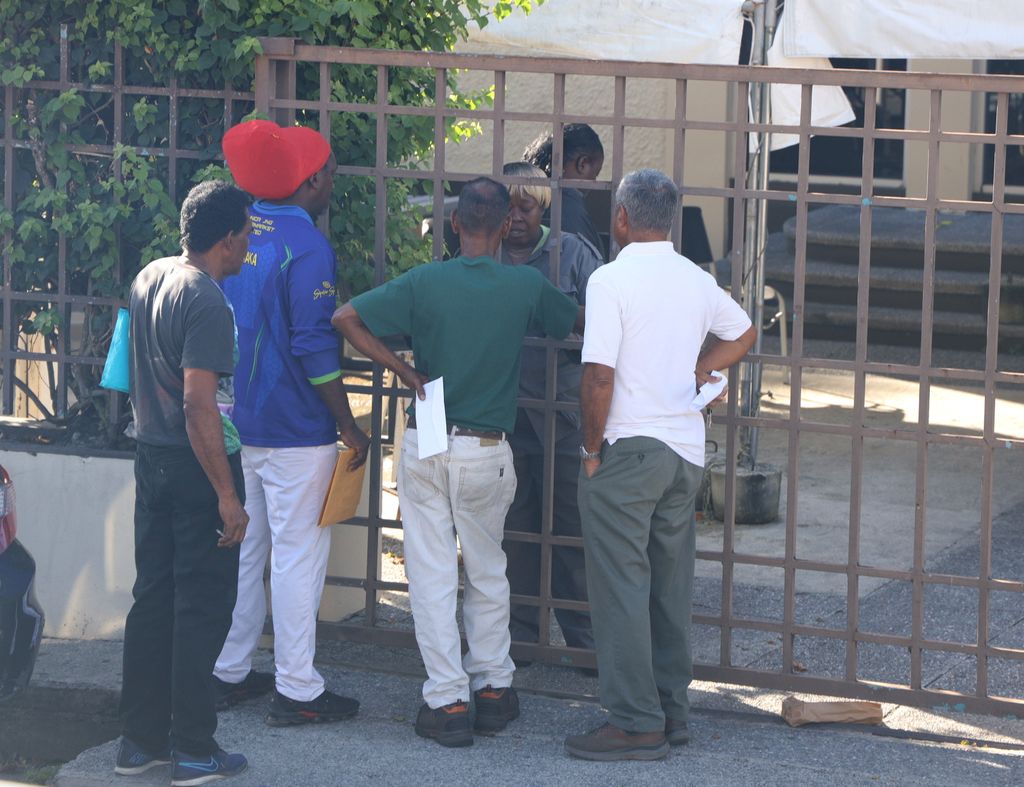 Customers line up outside NIB office, despite notice of closure ...